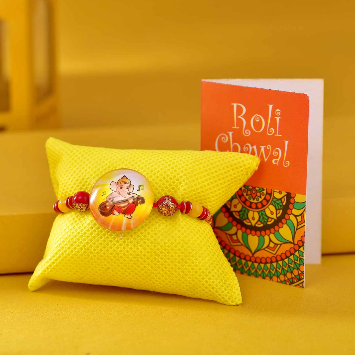 Lovable Ganesha Rakhi With Chocolate – TOKENZ